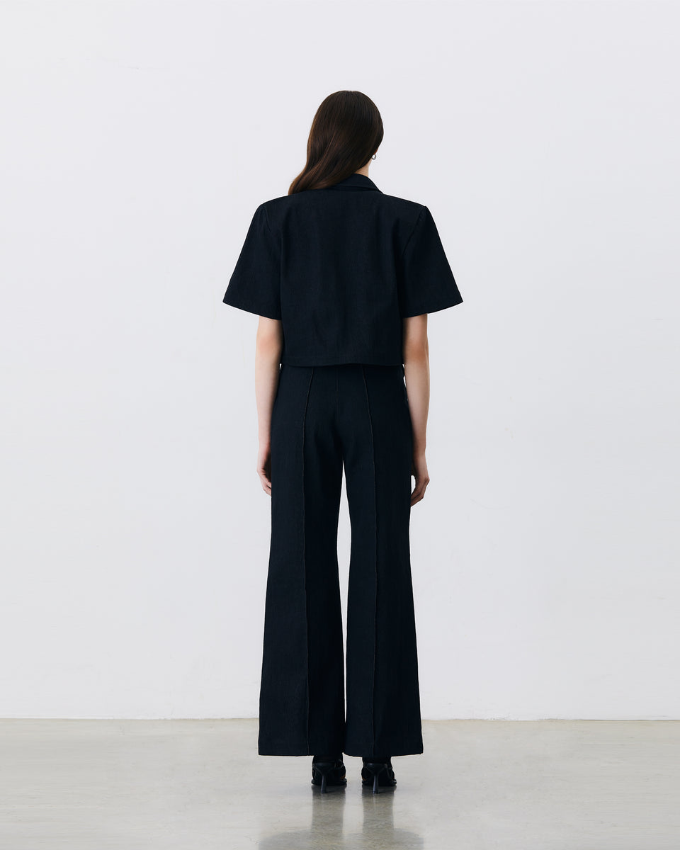 DISAYA l Black denim trouser with DISAYA logo silver hoop at flap pock